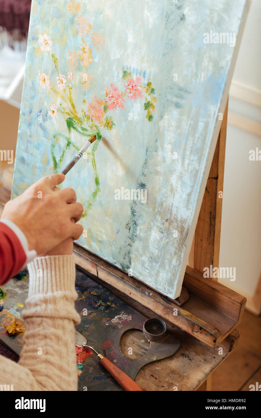 Close up of mans and womans hands painting together Stock Photo - Alamy
