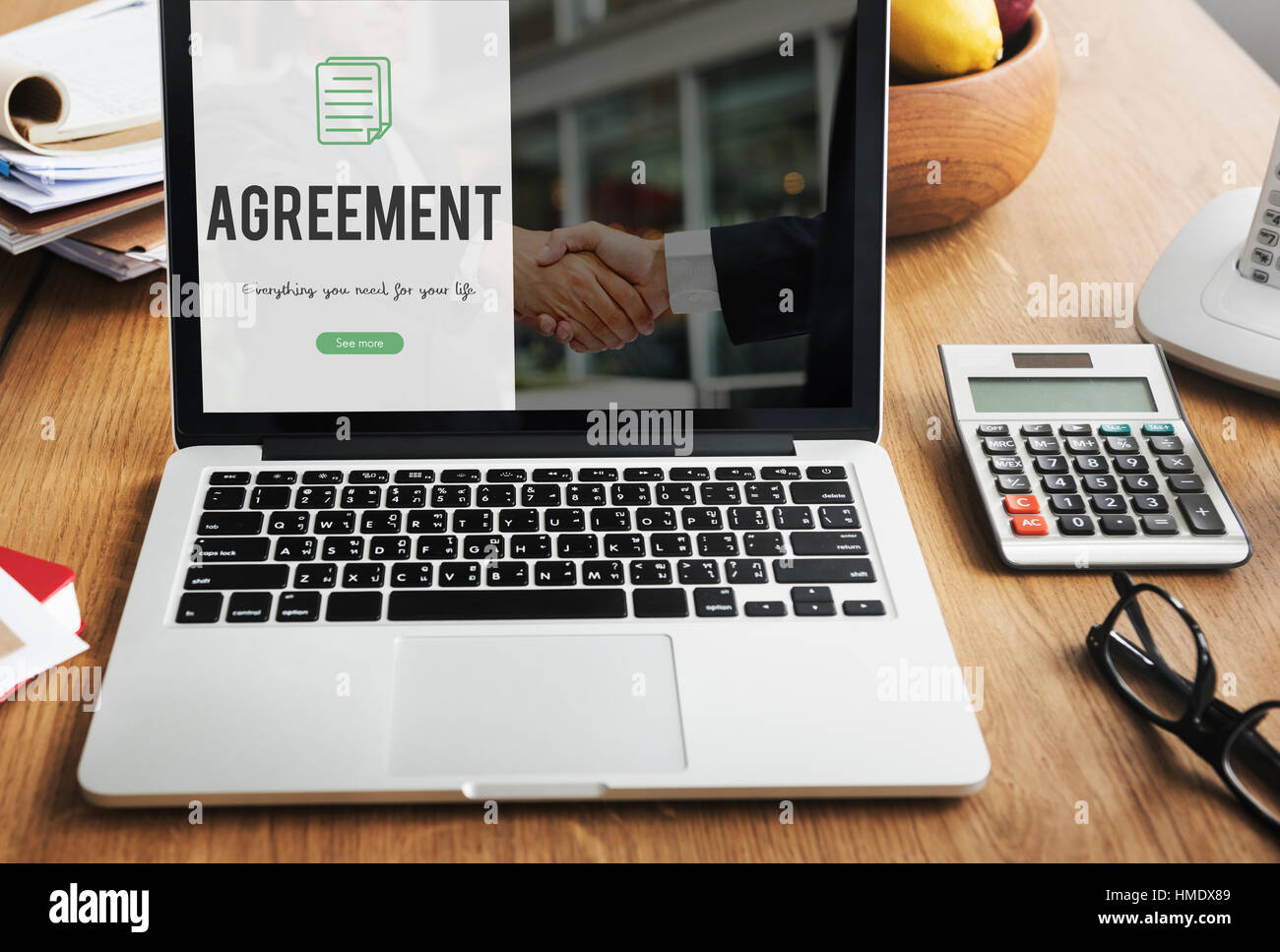 Agreement word on business handshake background Stock Photo - Alamy