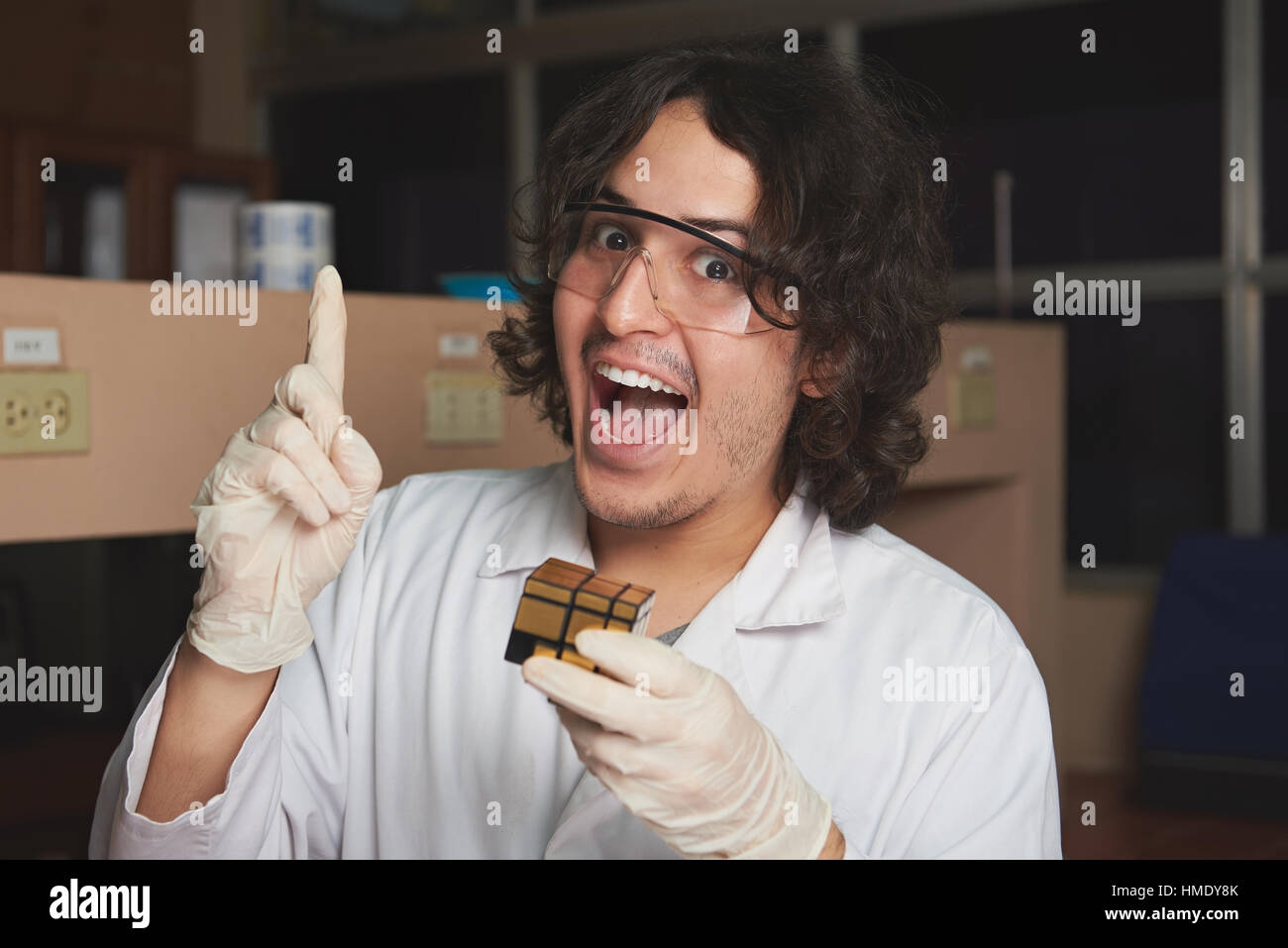 young happy chemist solved problem in lab Stock Photo - Alamy