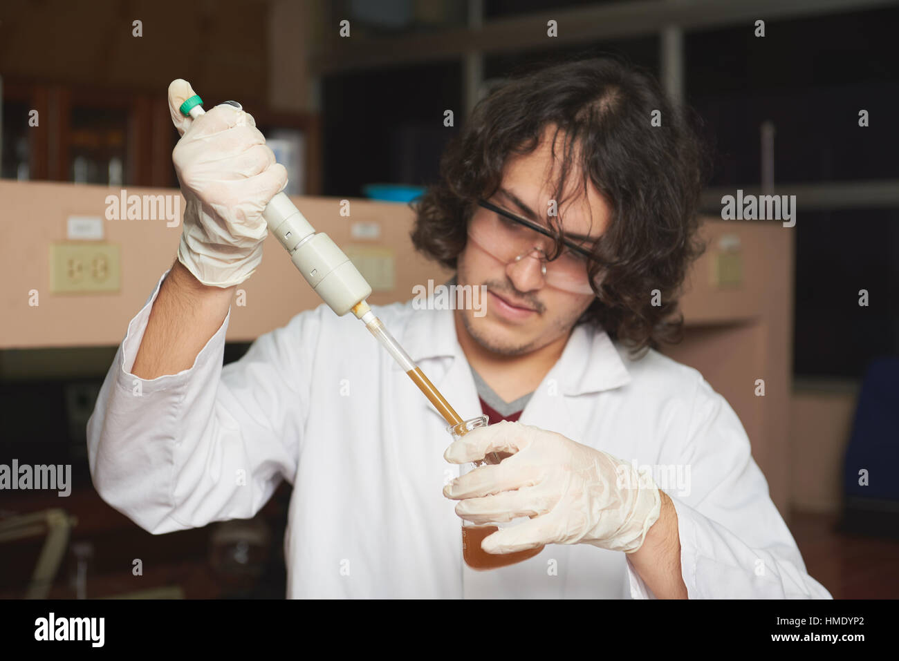 young biologist take brown sample of dirty water in lab Stock Photo - Alamy