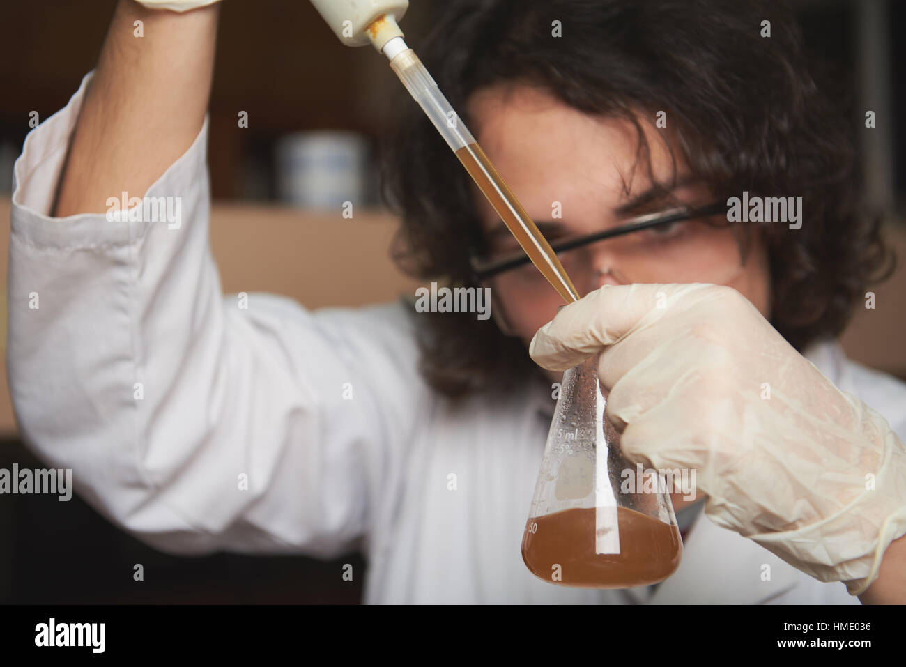 young chemist take sample of dirty water in lab Stock Photo - Alamy