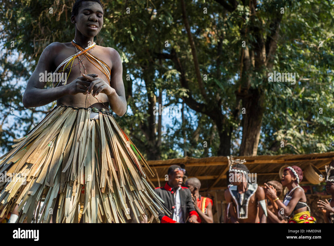 A young man performs traditional dance with fire at Zambia ...