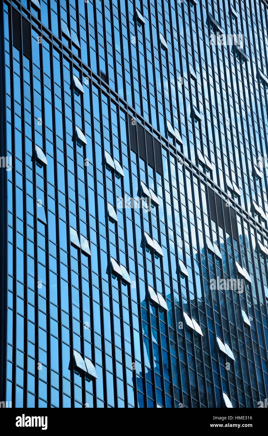 An abstract image of an exterior of a glass building within the city of ...