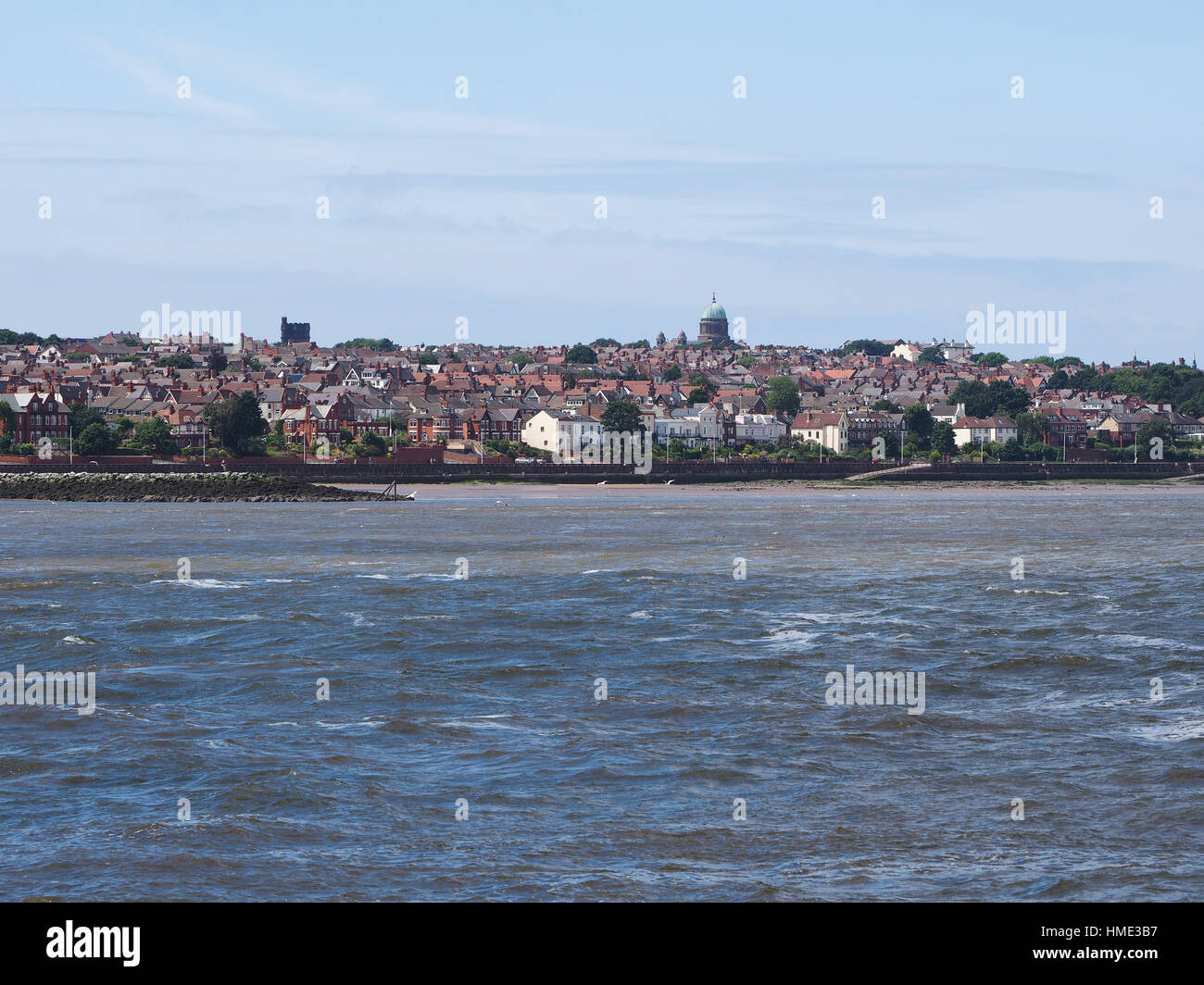 View of Birkenhead skyline across the Mersey river in Liverpool, UK ...