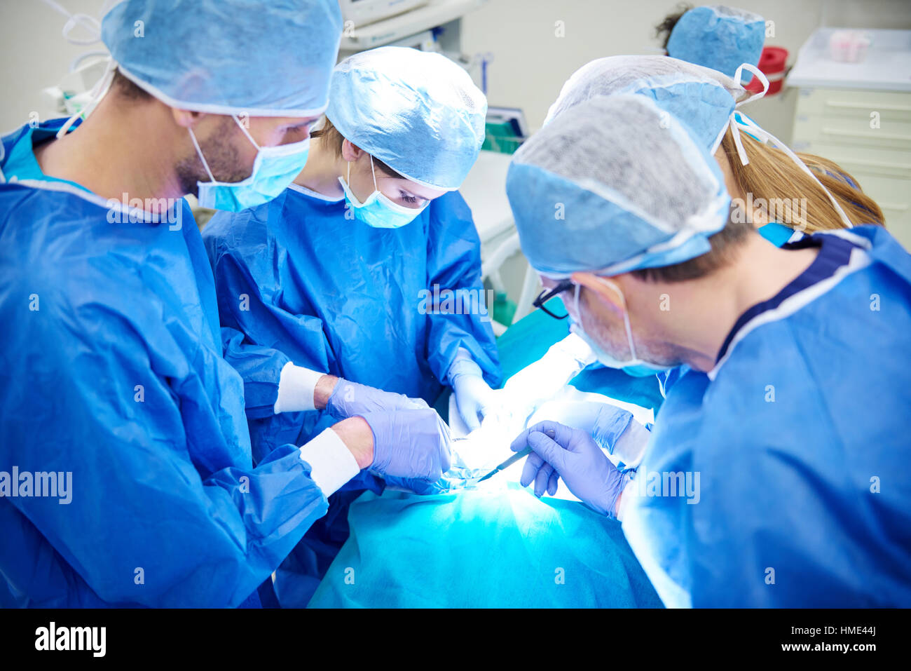 Difficult operation of busy surgeons Stock Photo - Alamy