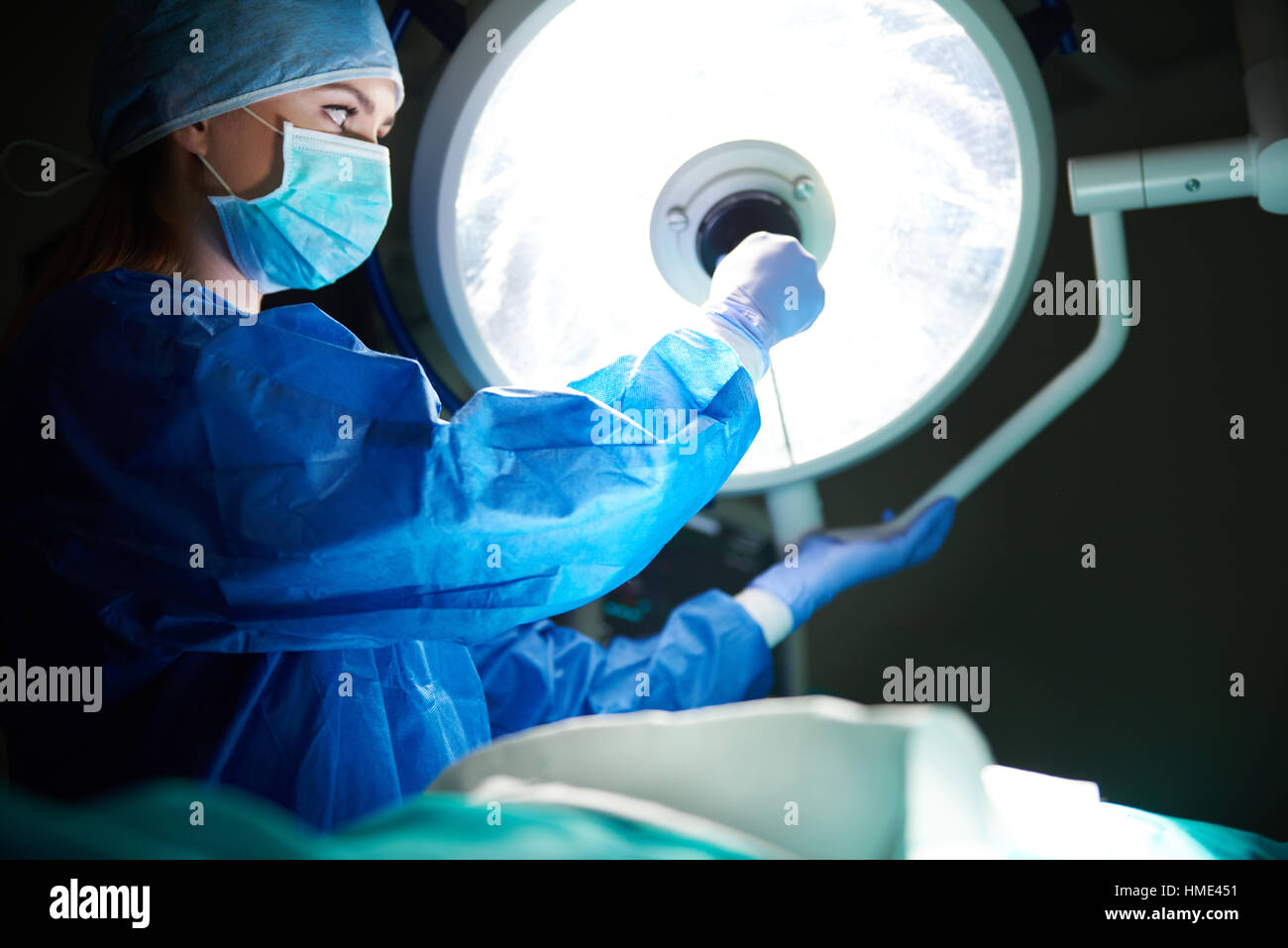 Doctor setting the surgical light Stock Photo - Alamy