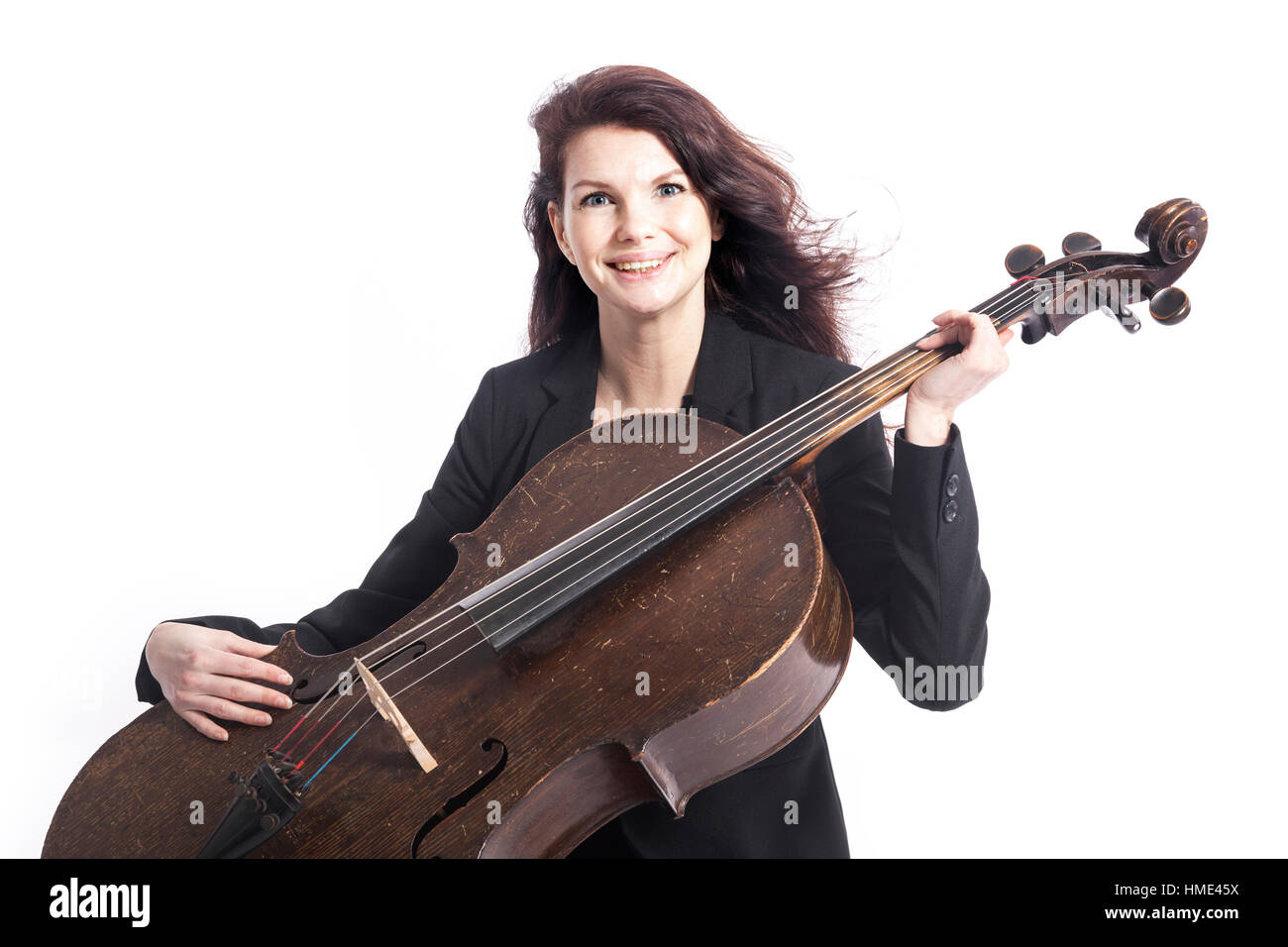 beautiful brunette with cello in studio against white background Stock ...