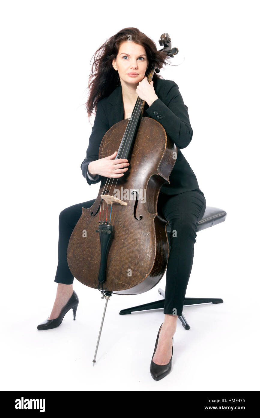 beautiful brunette with cello in studio against white background Stock ...