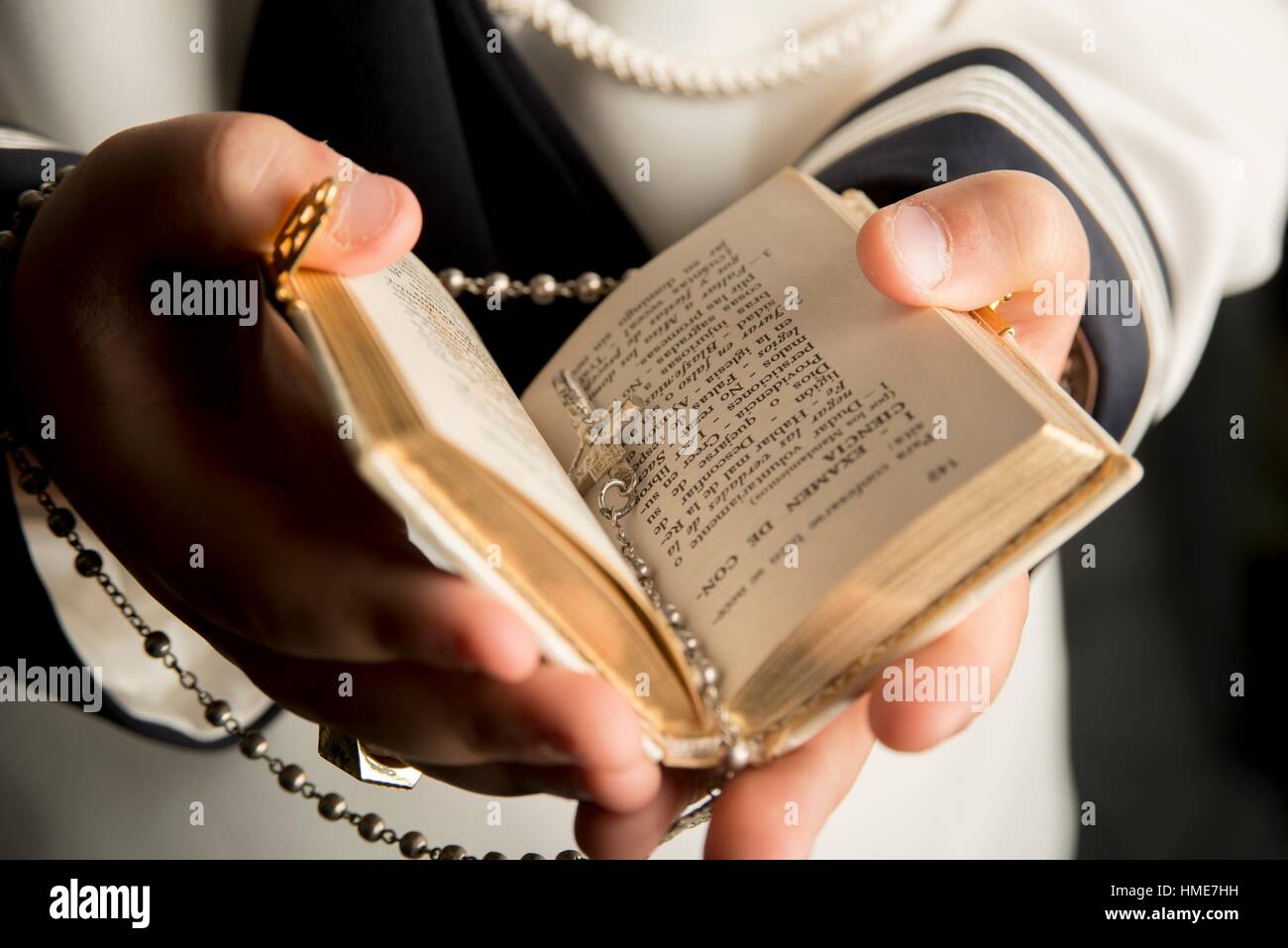 Child reading the Bible on the day of his first communion Stock Photo ...