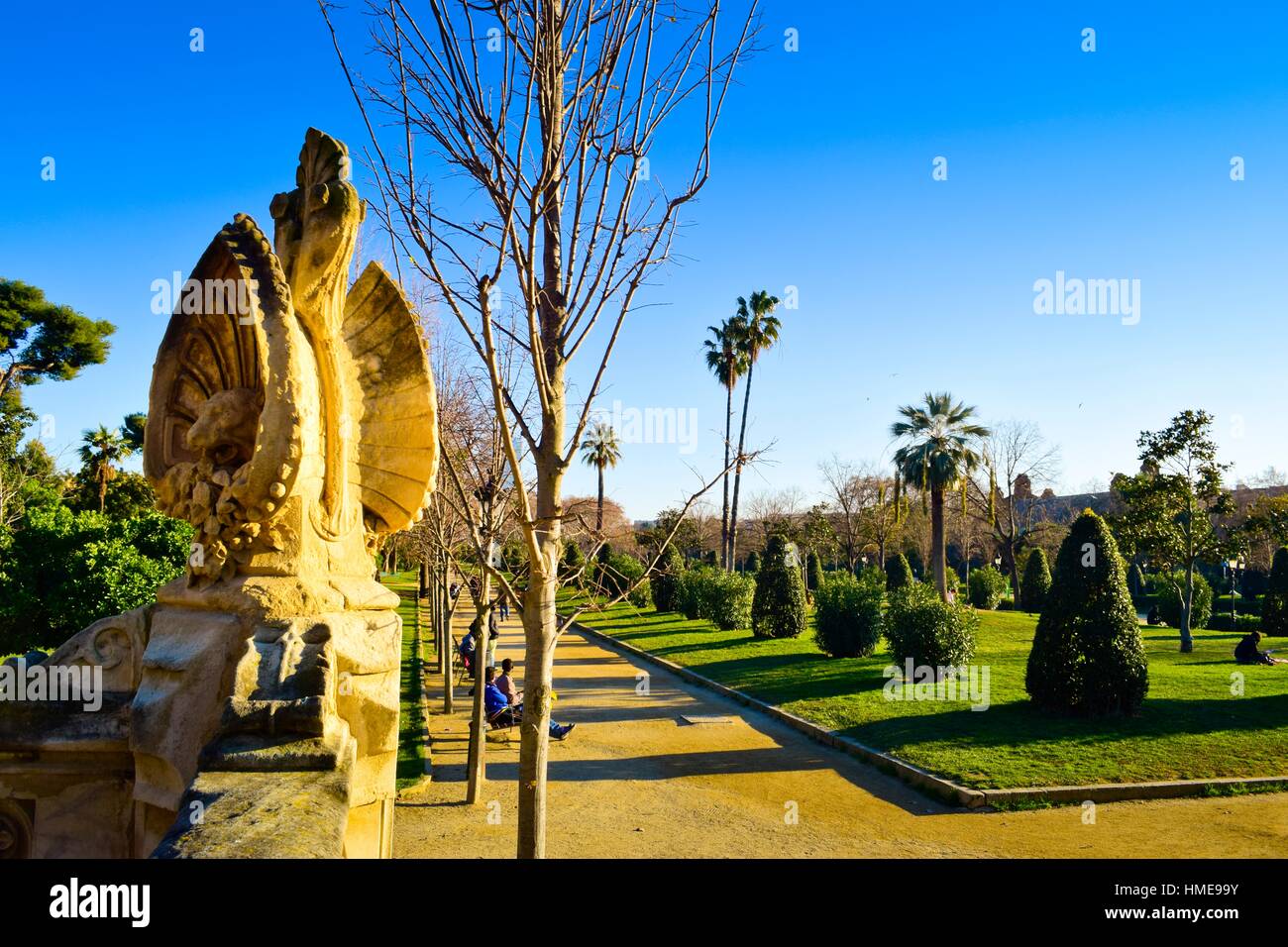 Panorama of Ciutadella Park with a path, green grass and trees. Parc de ...