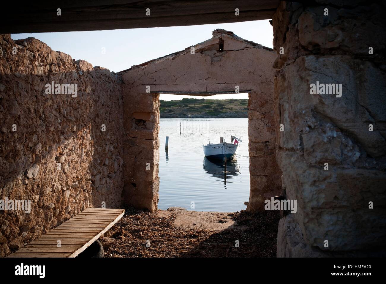 Menorca typical fishing boat view from a fisherman´s house in ruins ...