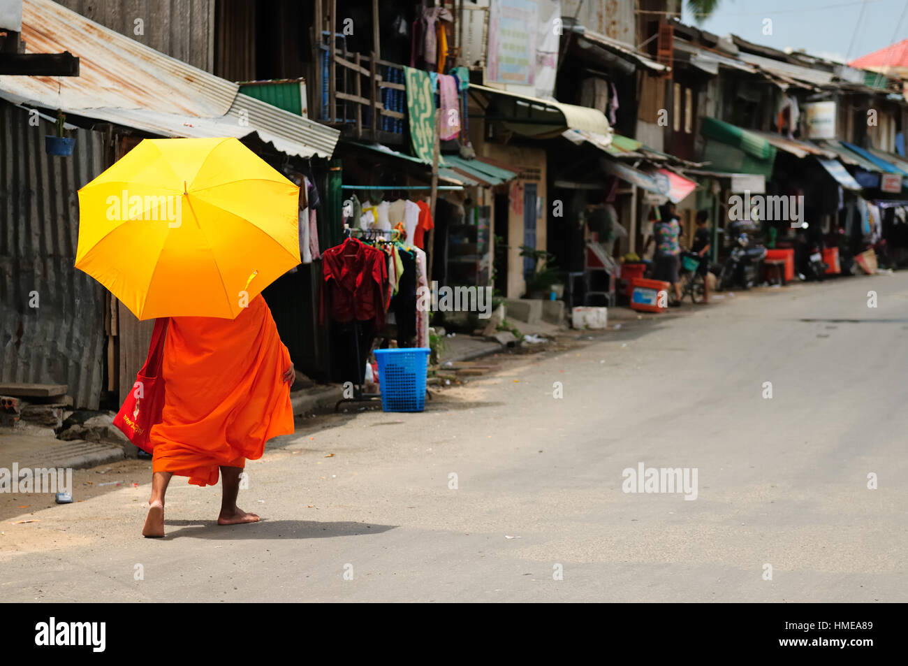 A Cambodian monk walking no the street in Phnom Penh Stock Photo - Alamy