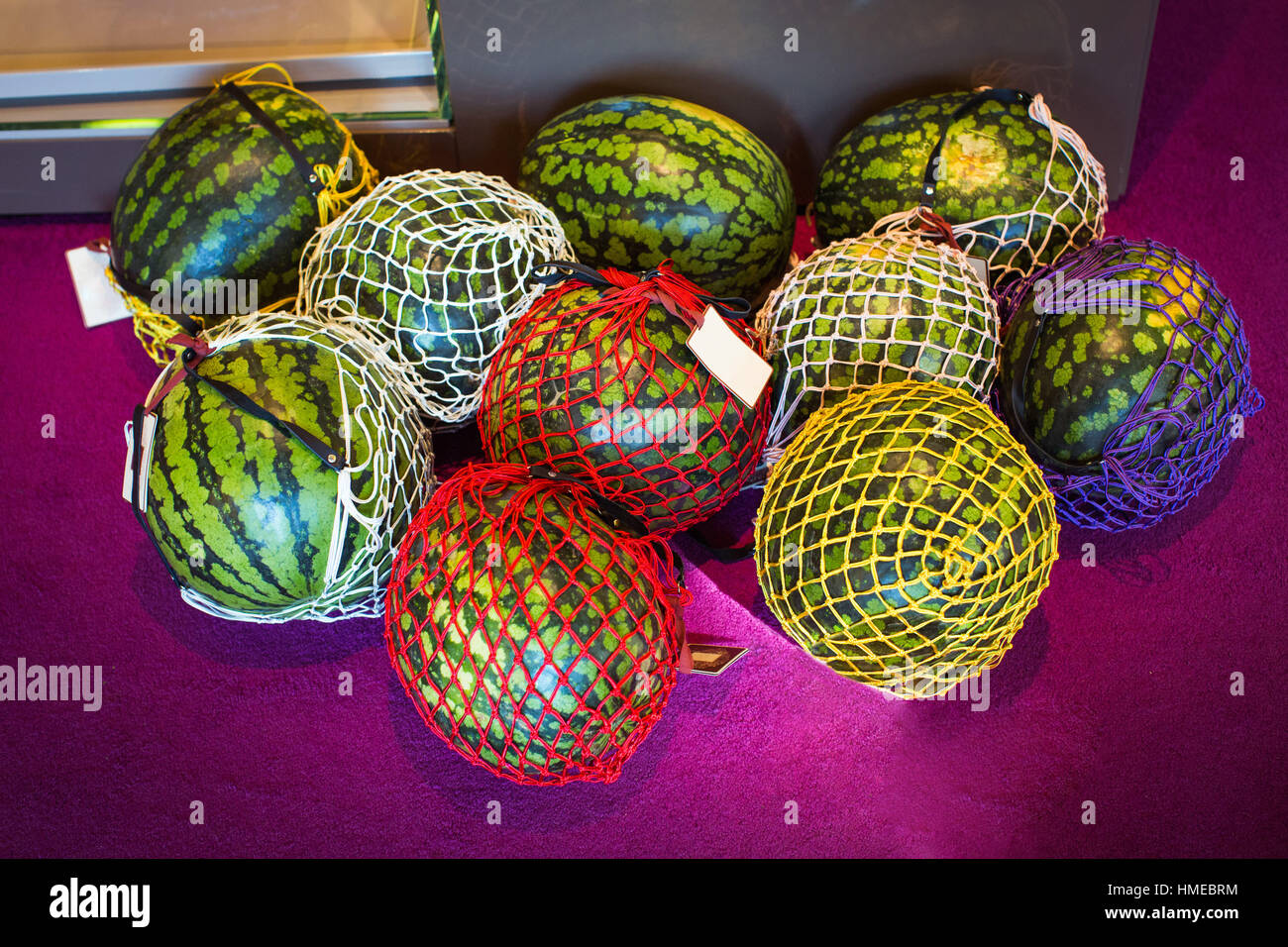 Watermelons in nets close-up on the floor Stock Photo - Alamy