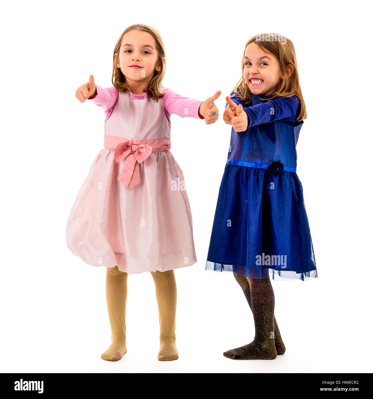 Children posing in studio, fooling around making different facial ...