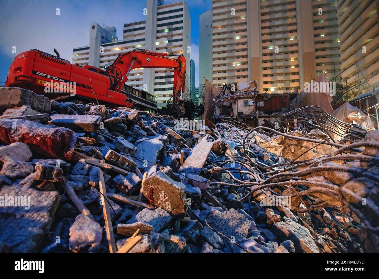 Demolition with an Excavator at Night Stock Photo - Alamy