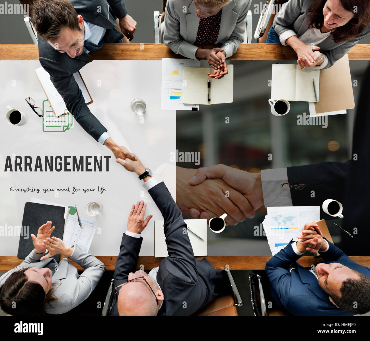Arrangement word on business handshake background Stock Photo - Alamy