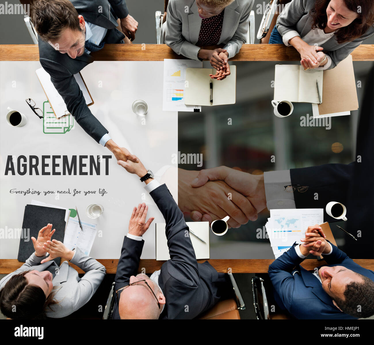 Agreement word on business handshake background Stock Photo - Alamy