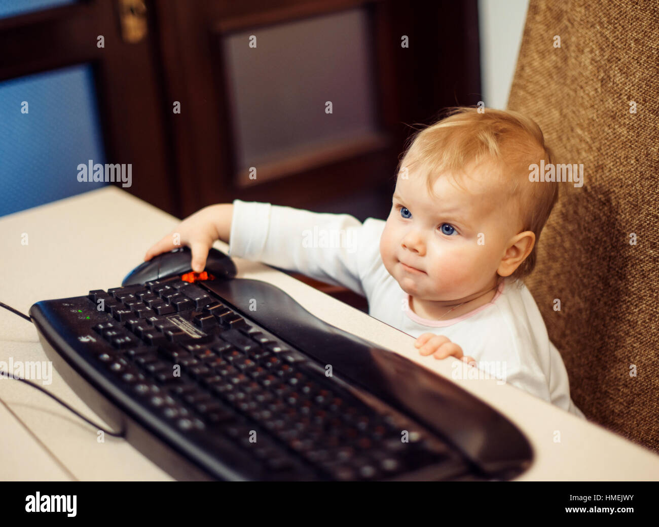 Little child with keyboard Stock Photo - Alamy