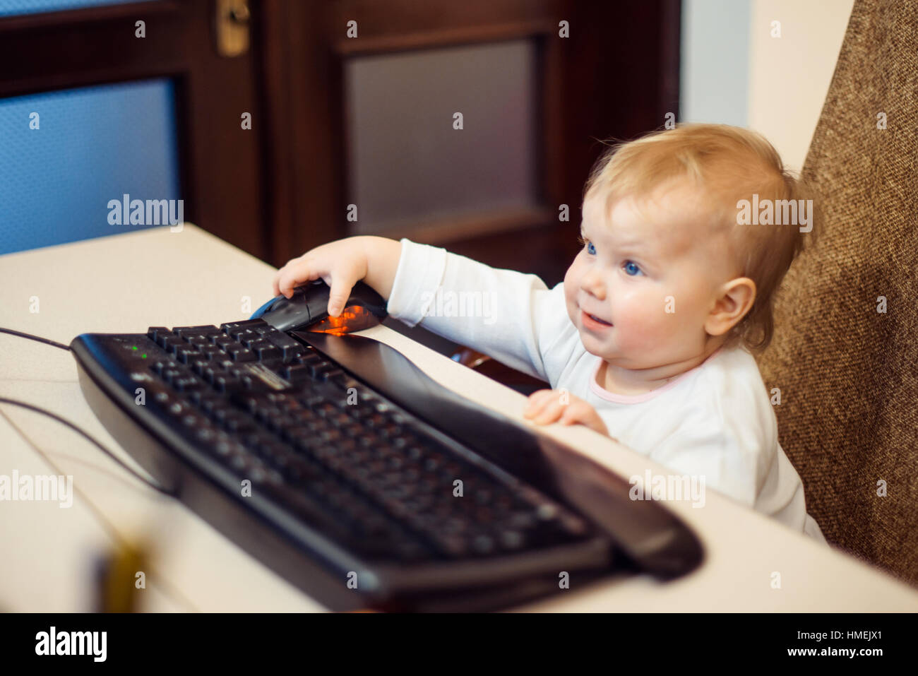 Little child with keyboard Stock Photo - Alamy
