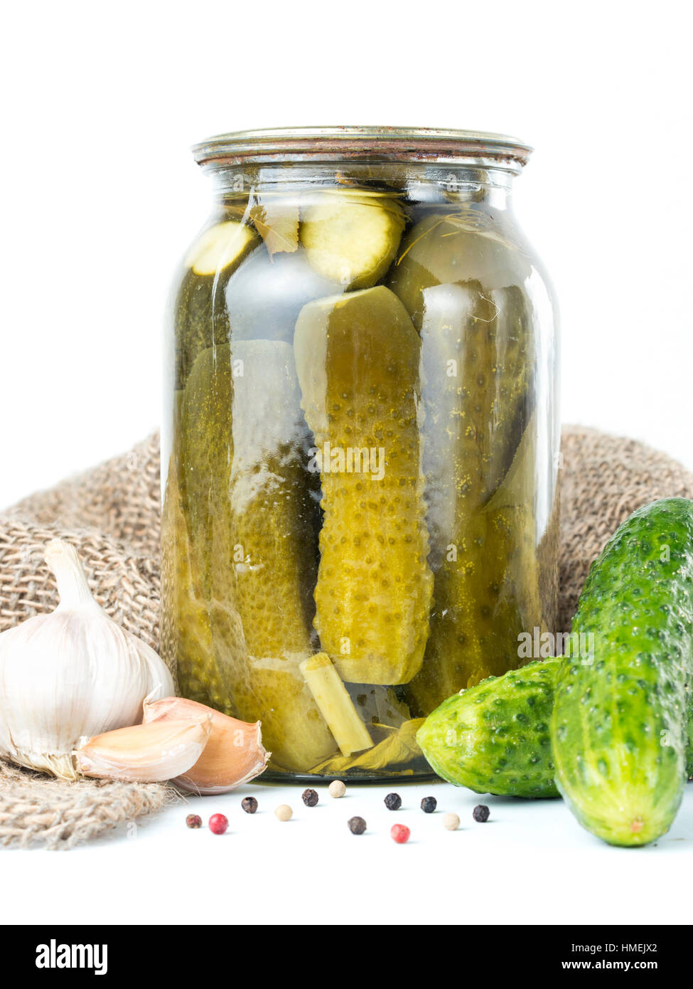 Pickles in glass jar isolated on white Stock Photo - Alamy