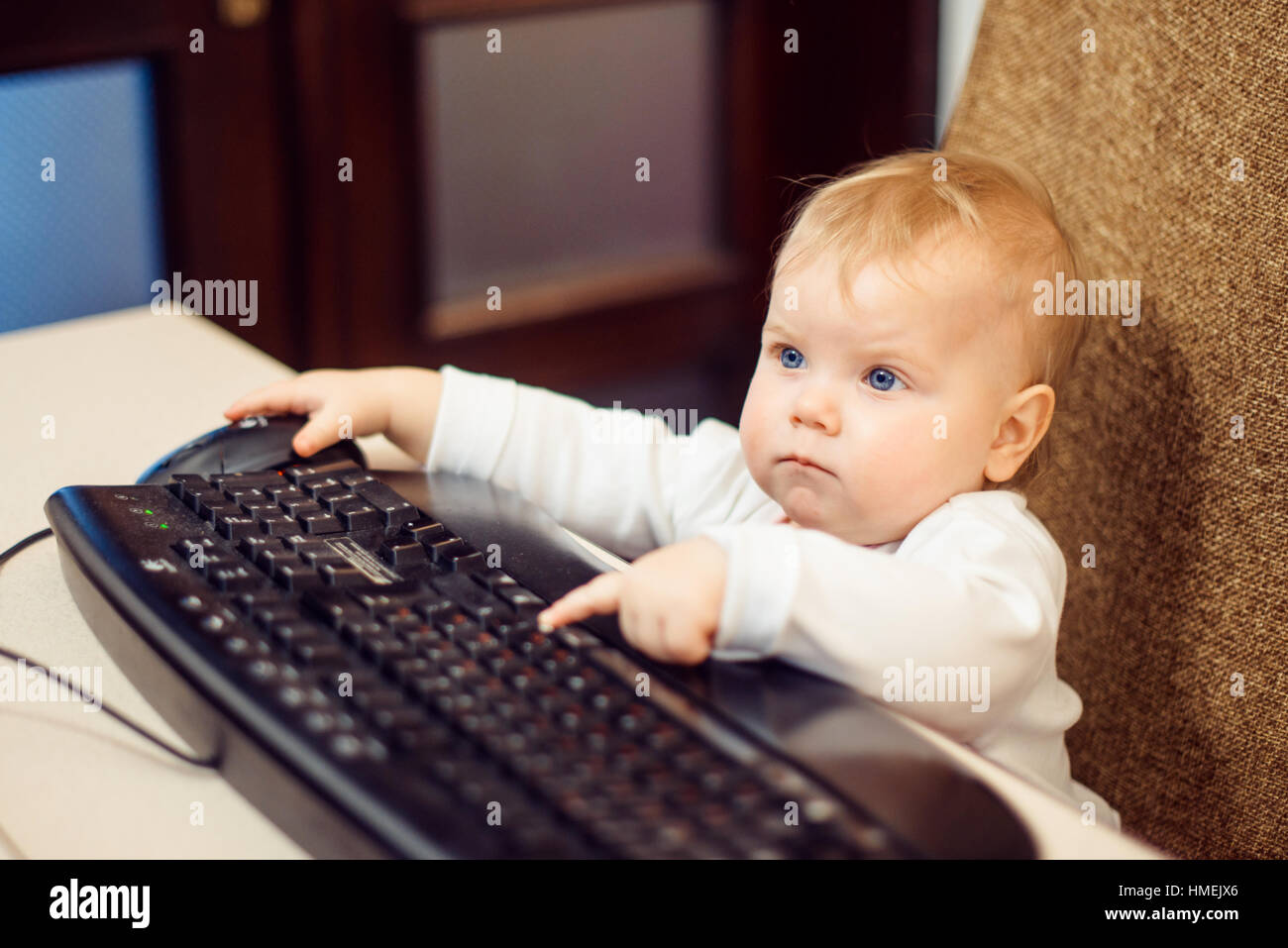 Little child with keyboard Stock Photo - Alamy
