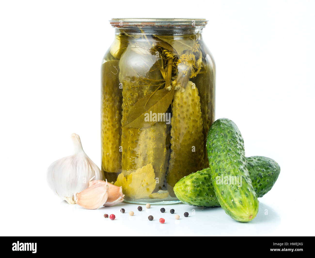 Pickles in glass jar isolated on white Stock Photo - Alamy