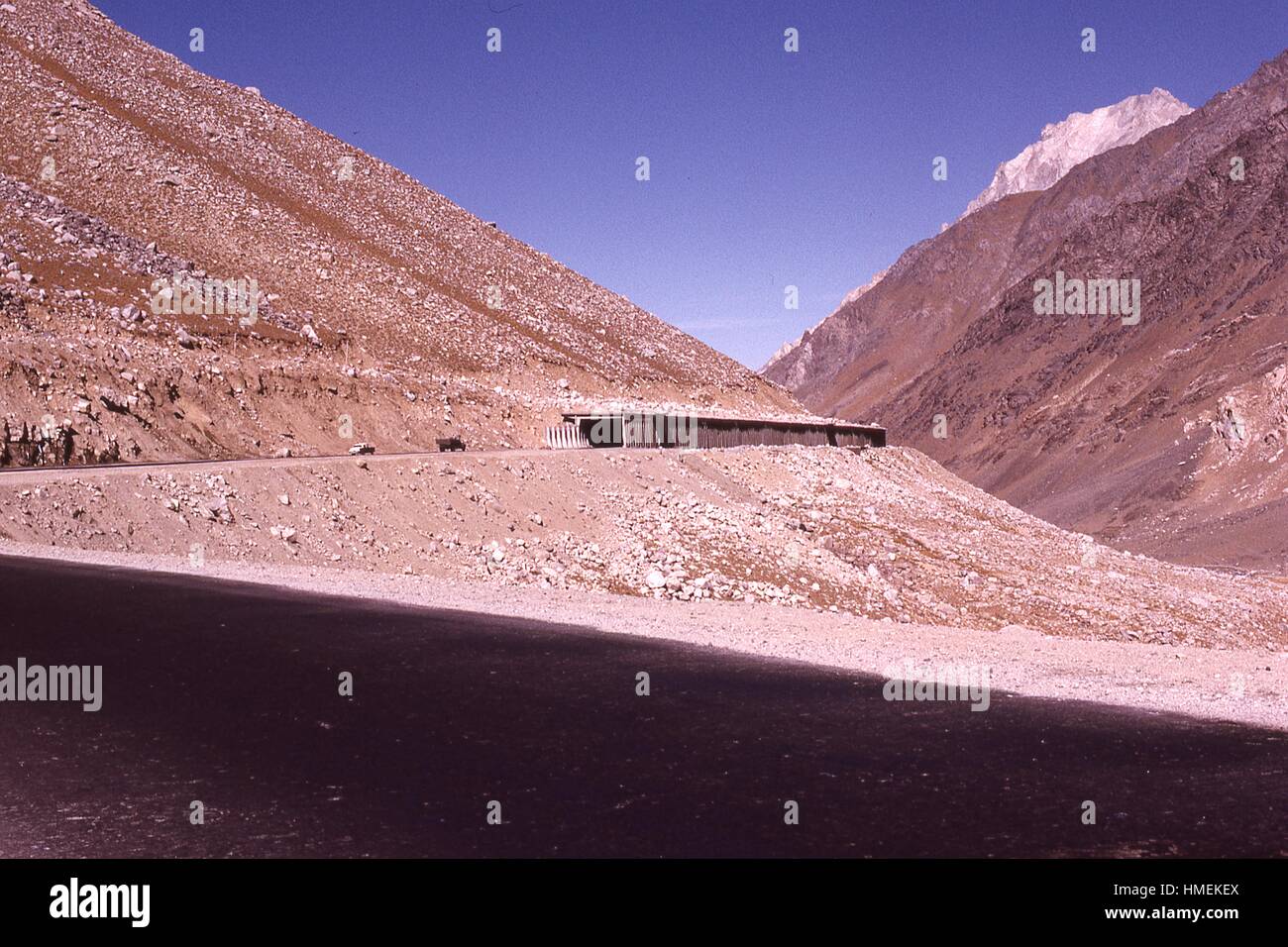 View from a vehicle approaching the entrance to the Salang Tunnel ...