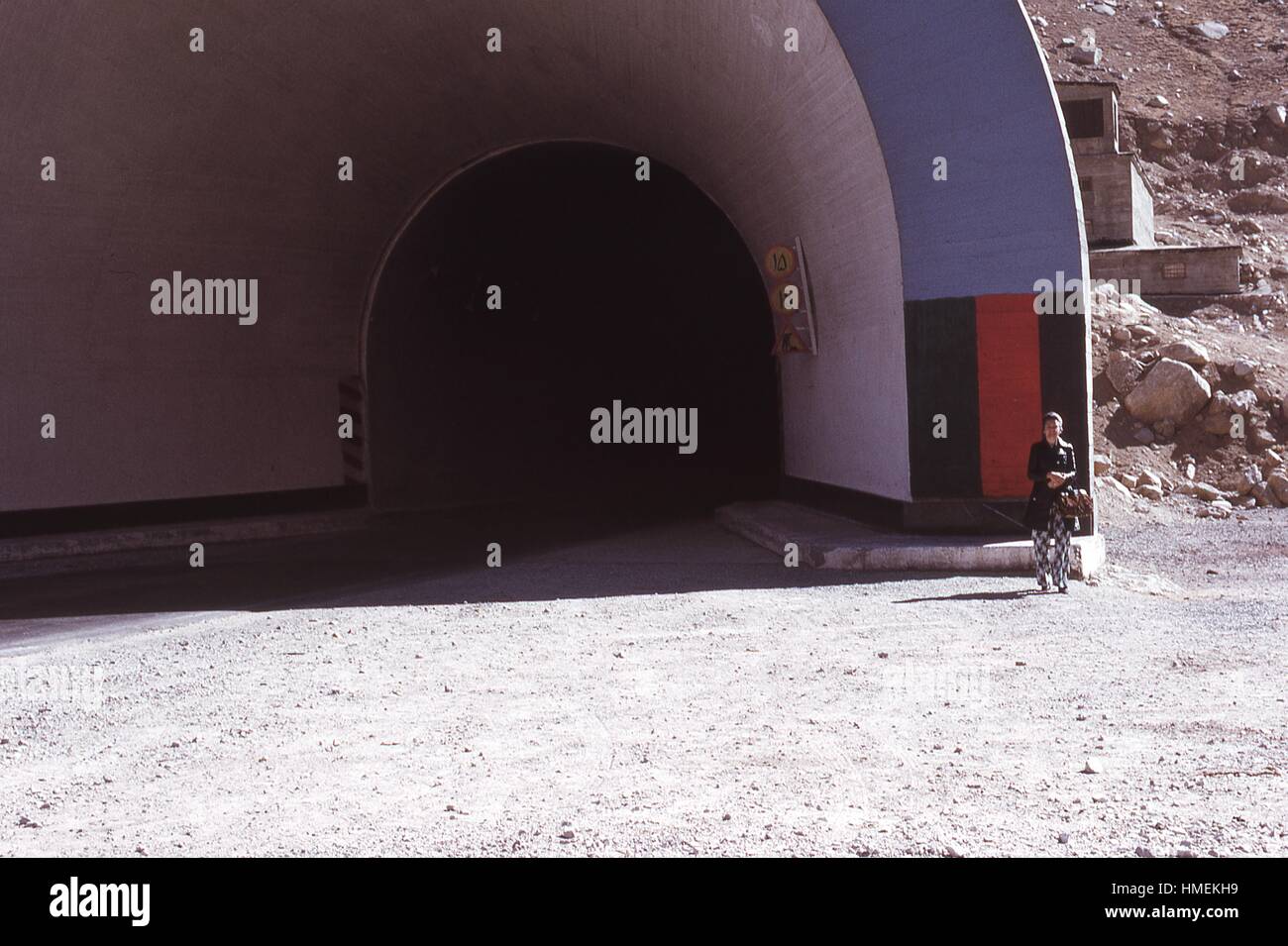 Western woman poses outside the entrance to the Salang Tunnel, located ...