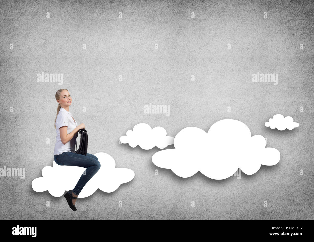 Girl riding cloud Stock Photo - Alamy