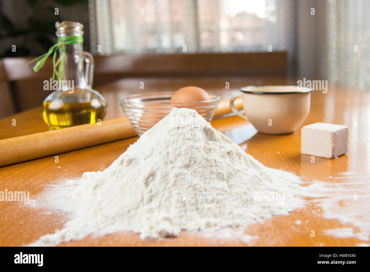 Dough making ingredients on a kitchen table Stock Photo - Alamy