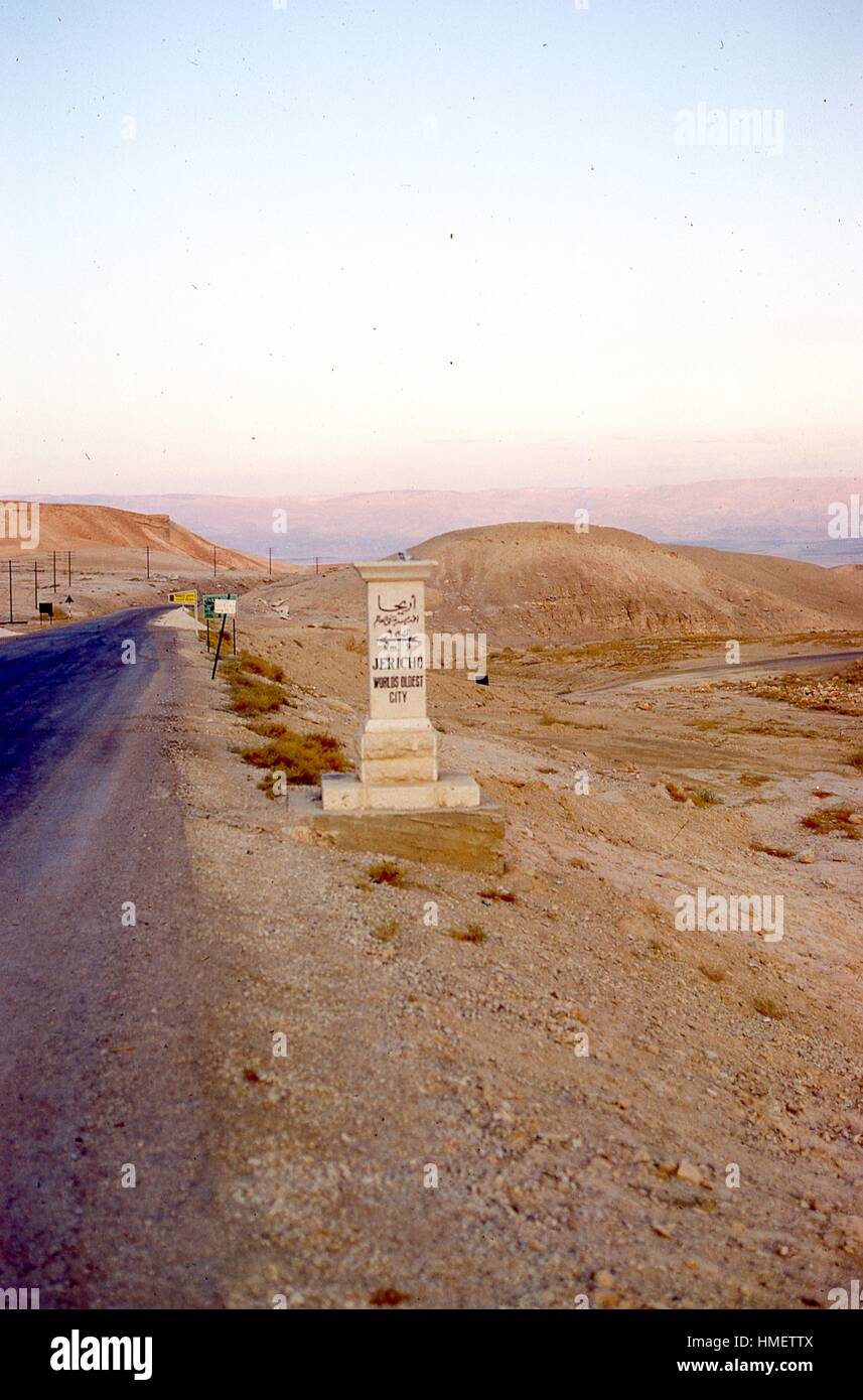 Stone obelisk directional sign reading 'World's Oldest City' in Arabic ...
