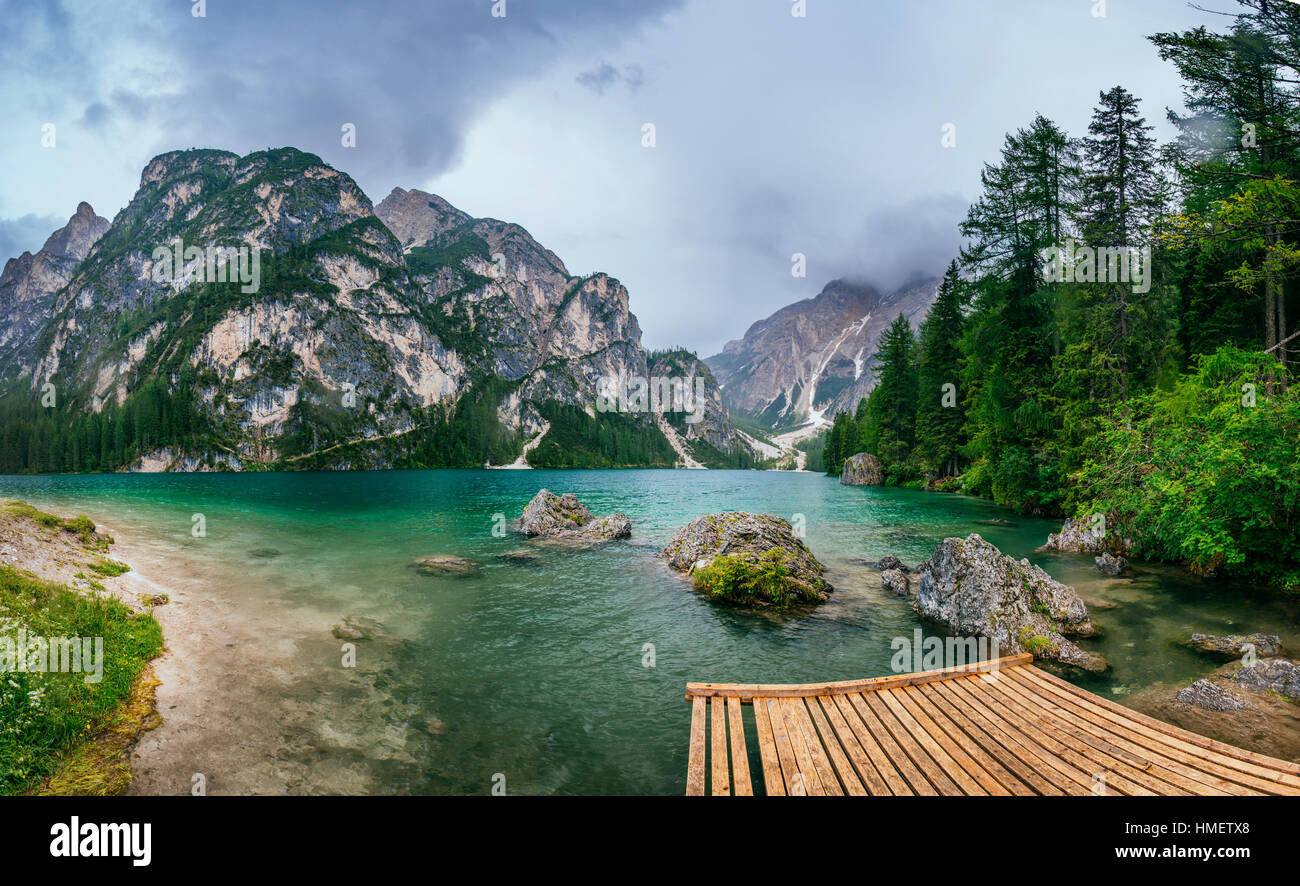 Mountain lake between by mountains Stock Photo - Alamy