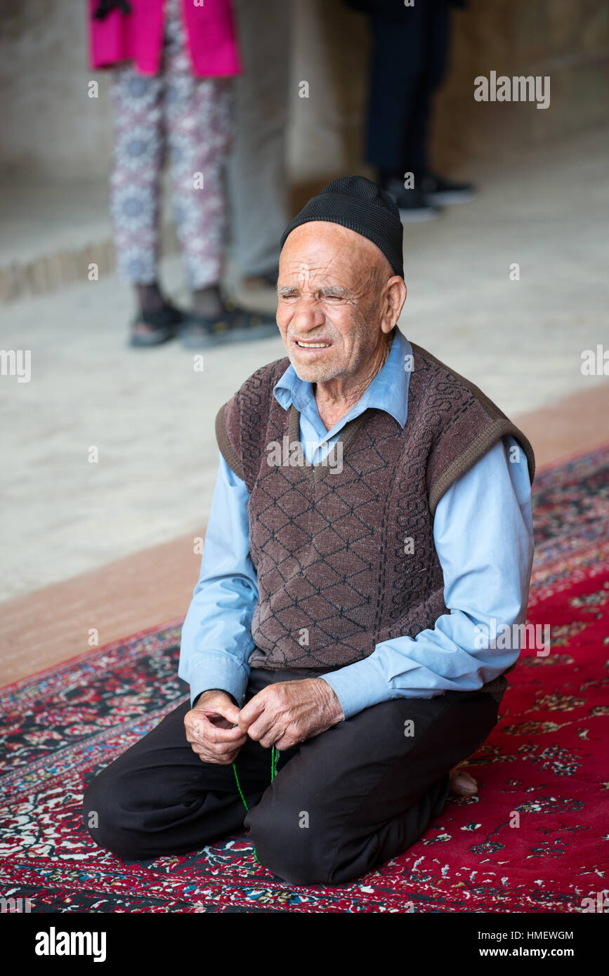 An old muslim man praying at Friday Mosque, Isfahan, Iran Stock Photo ...