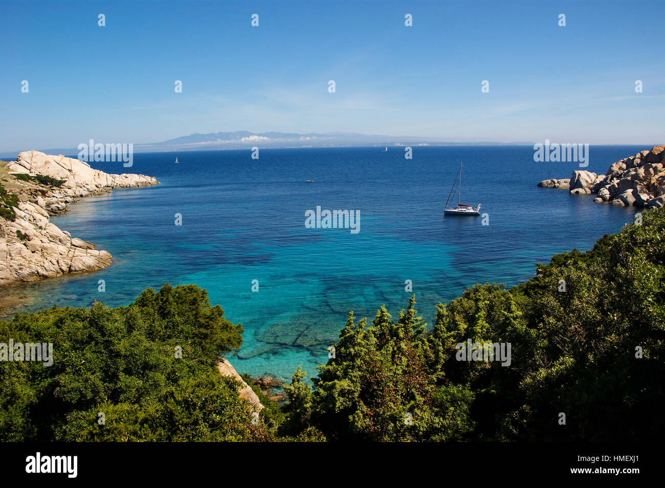 Small cove with turqoise blue water at Capo Testa in Sardinia boat and ...