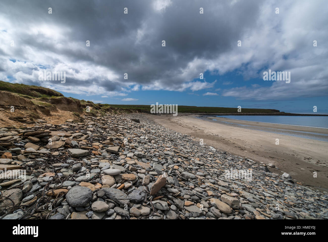 Rocks on the beach and ocean bay at Skara Brae Stock Photo - Alamy