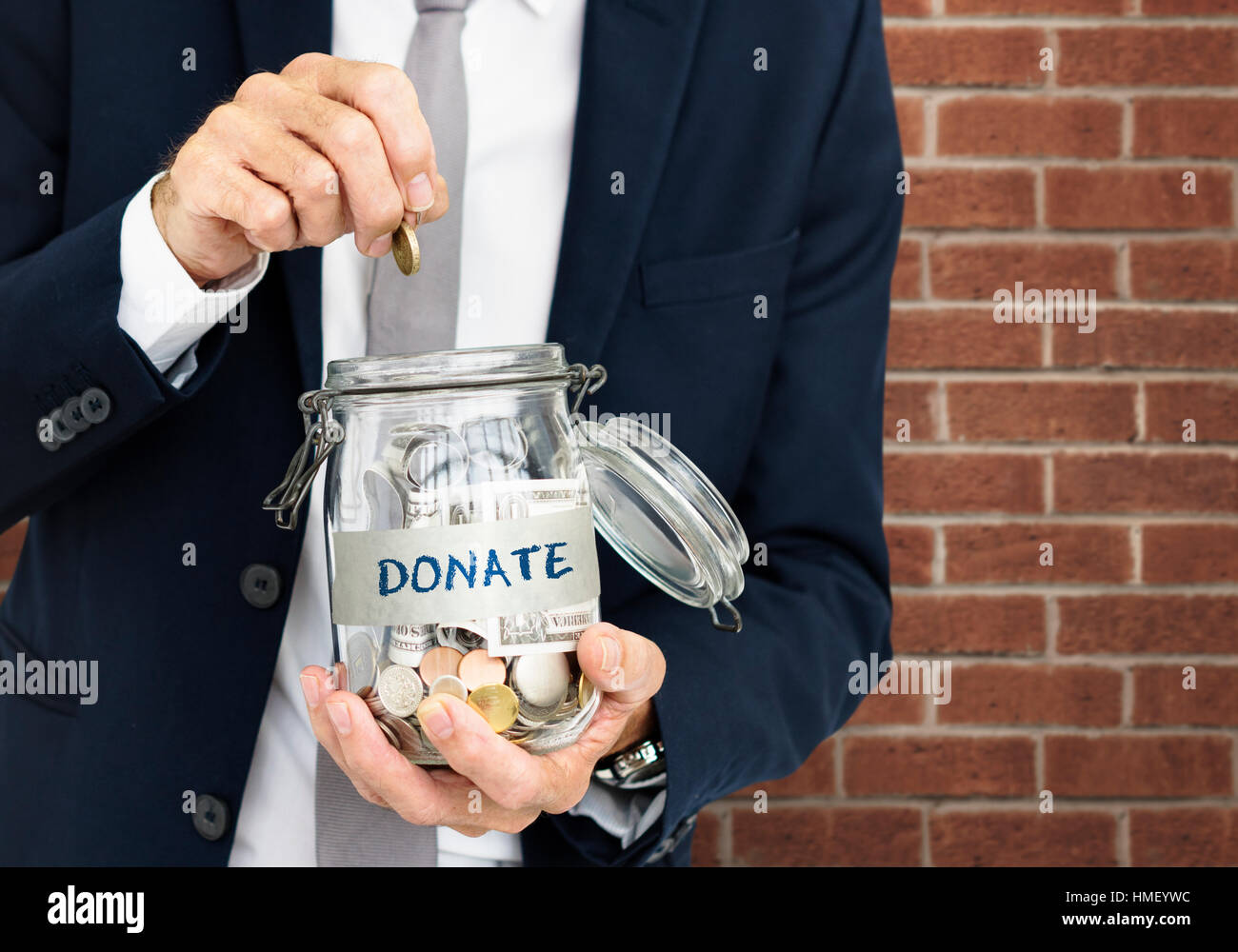 Businessman GIving Money Donation Charity Concept Stock Photo - Alamy