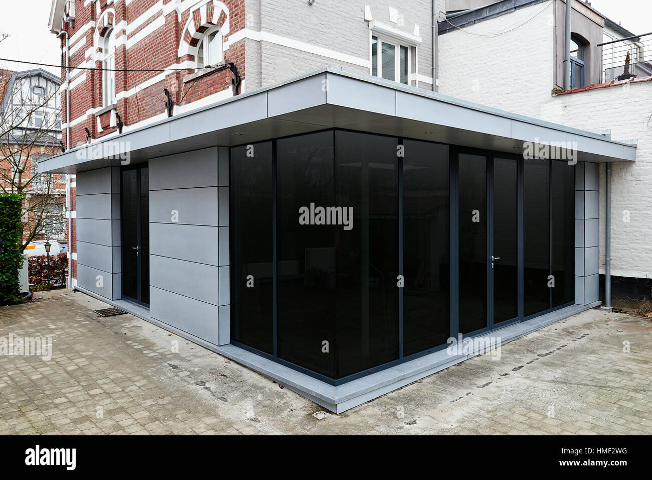 New modern extension of a house with big glasses windows and doors ...
