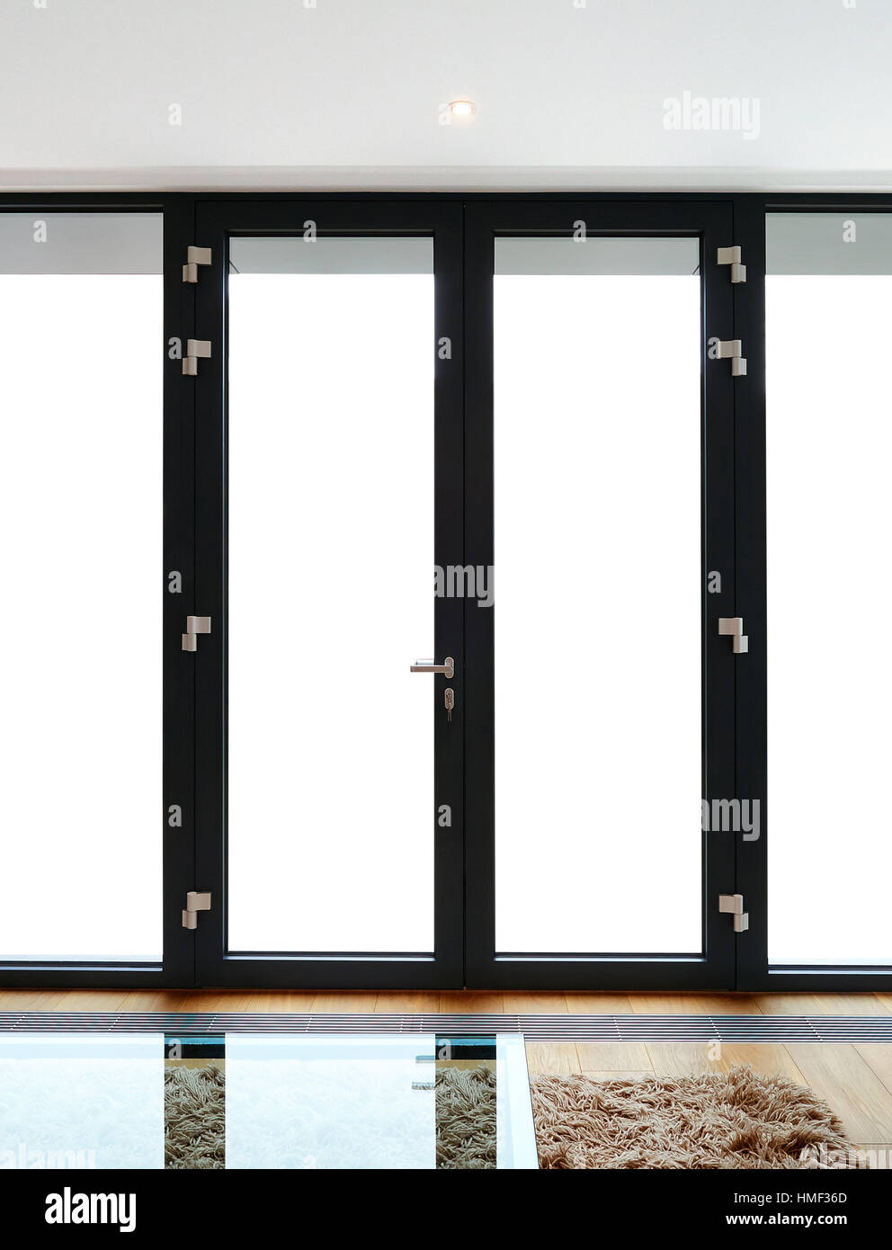 Living room with great windows and doors Stock Photo - Alamy