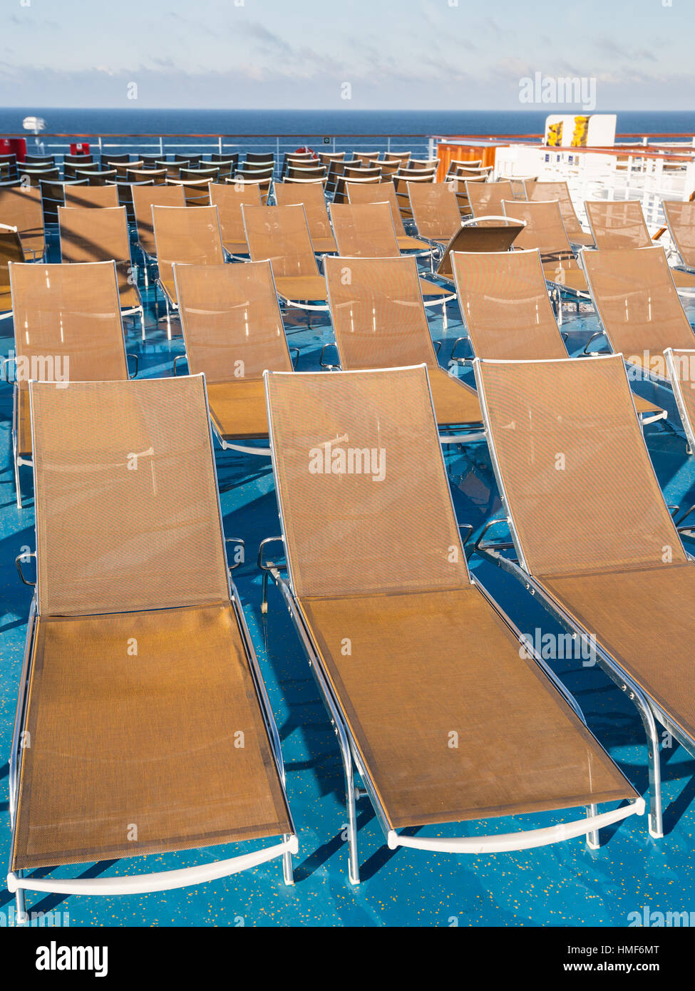 many empty sunbathing chairs on deck of cruise liner Stock Photo - Alamy