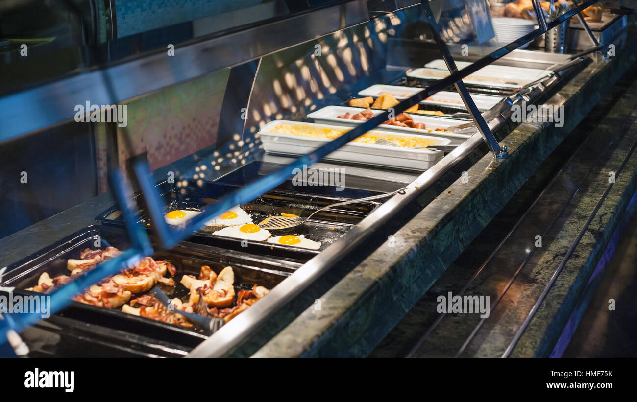 self-service buffet with hot breakfast - bacon, fried eggs , scrambled ...