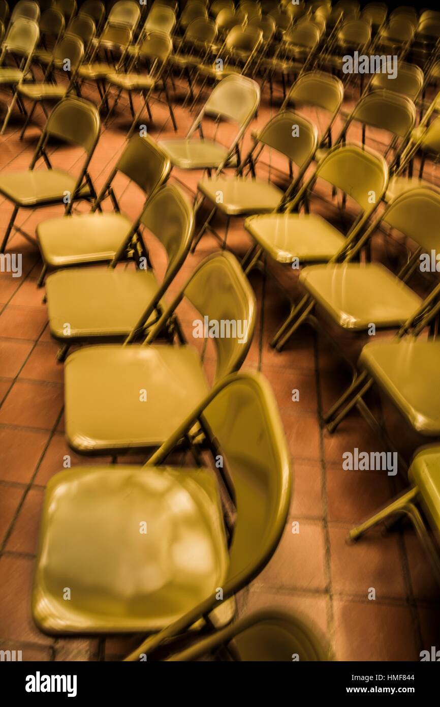 Empty folding metal chairs in an auditorium Stock Photo - Alamy