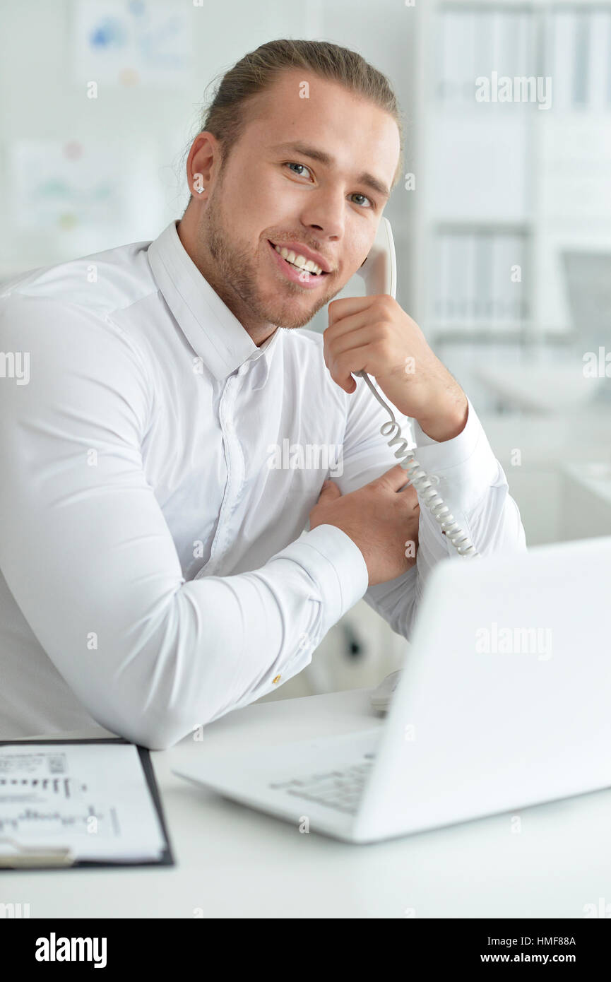 Young handsome office worker hi-res stock photography and images - Alamy