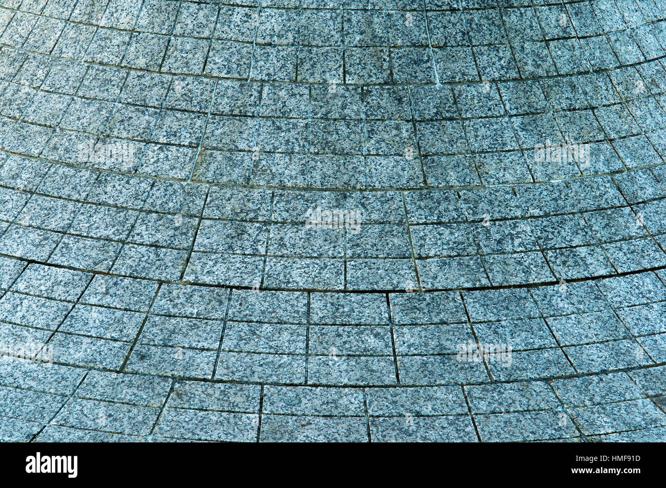 paving slabs in a circle, the tiles covering the bulge of the fountain ...