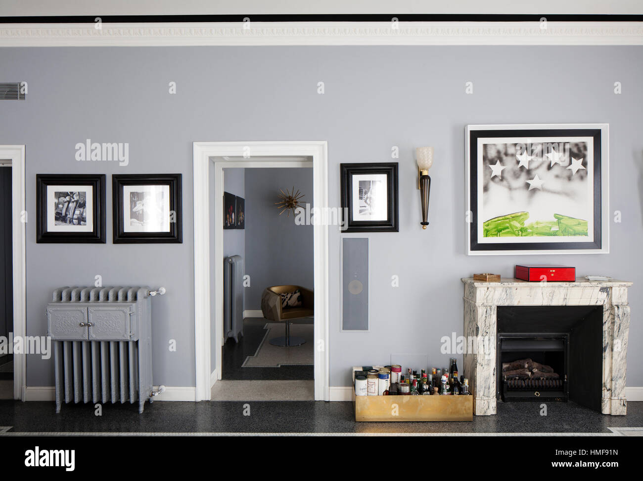 Interior of a Living room with fireplace and famous paintings Stock ...