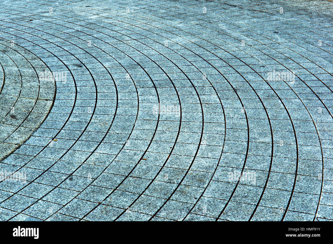 paving slabs in a circle, the tiles covering the bulge of the fountain ...
