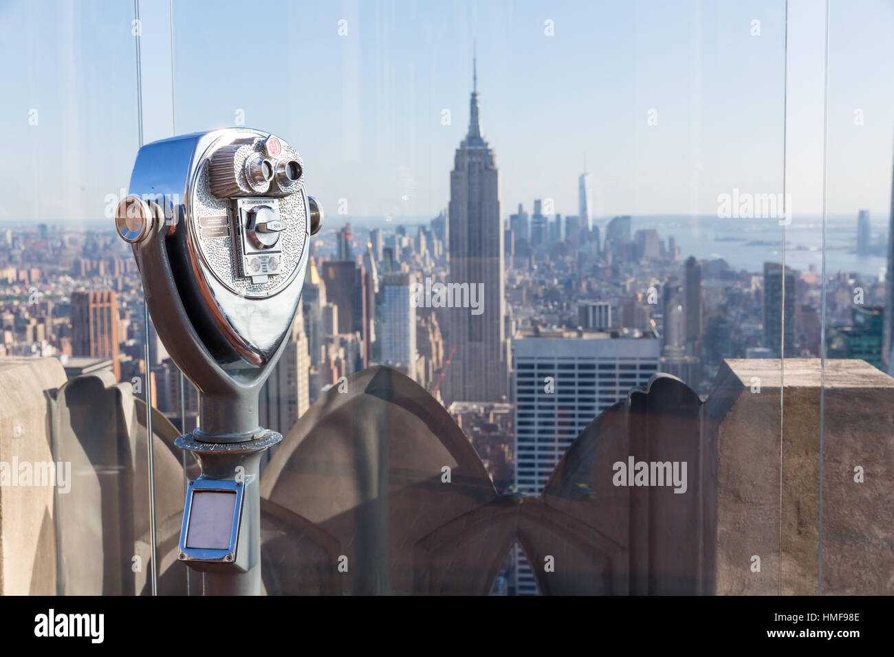 Observation deck view against coin operated binocular. Blur city on ...