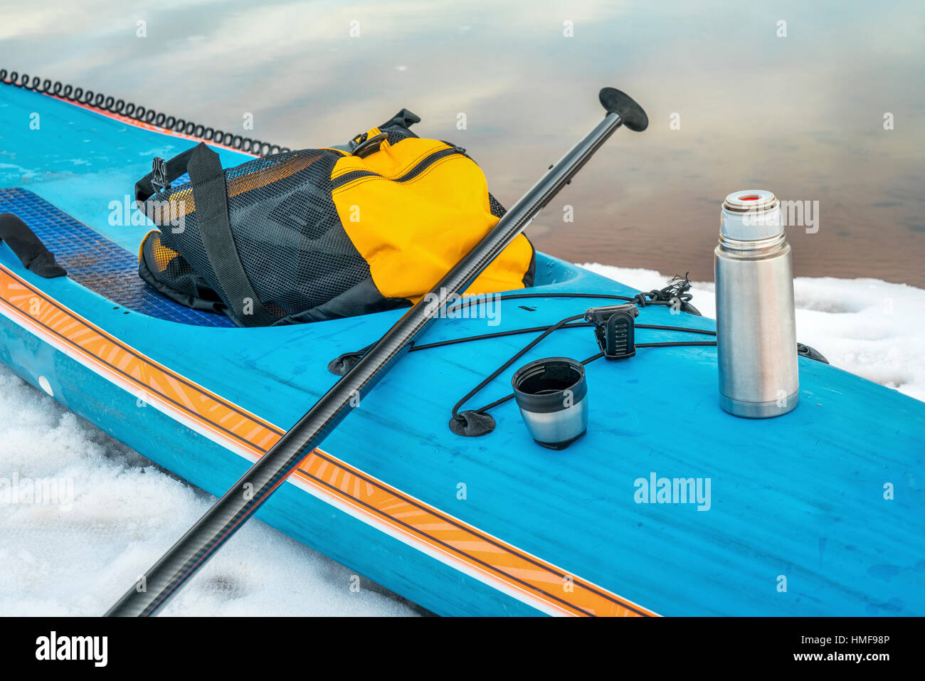 a hot tea stop during winter stand up paddling workout Stock Photo - Alamy