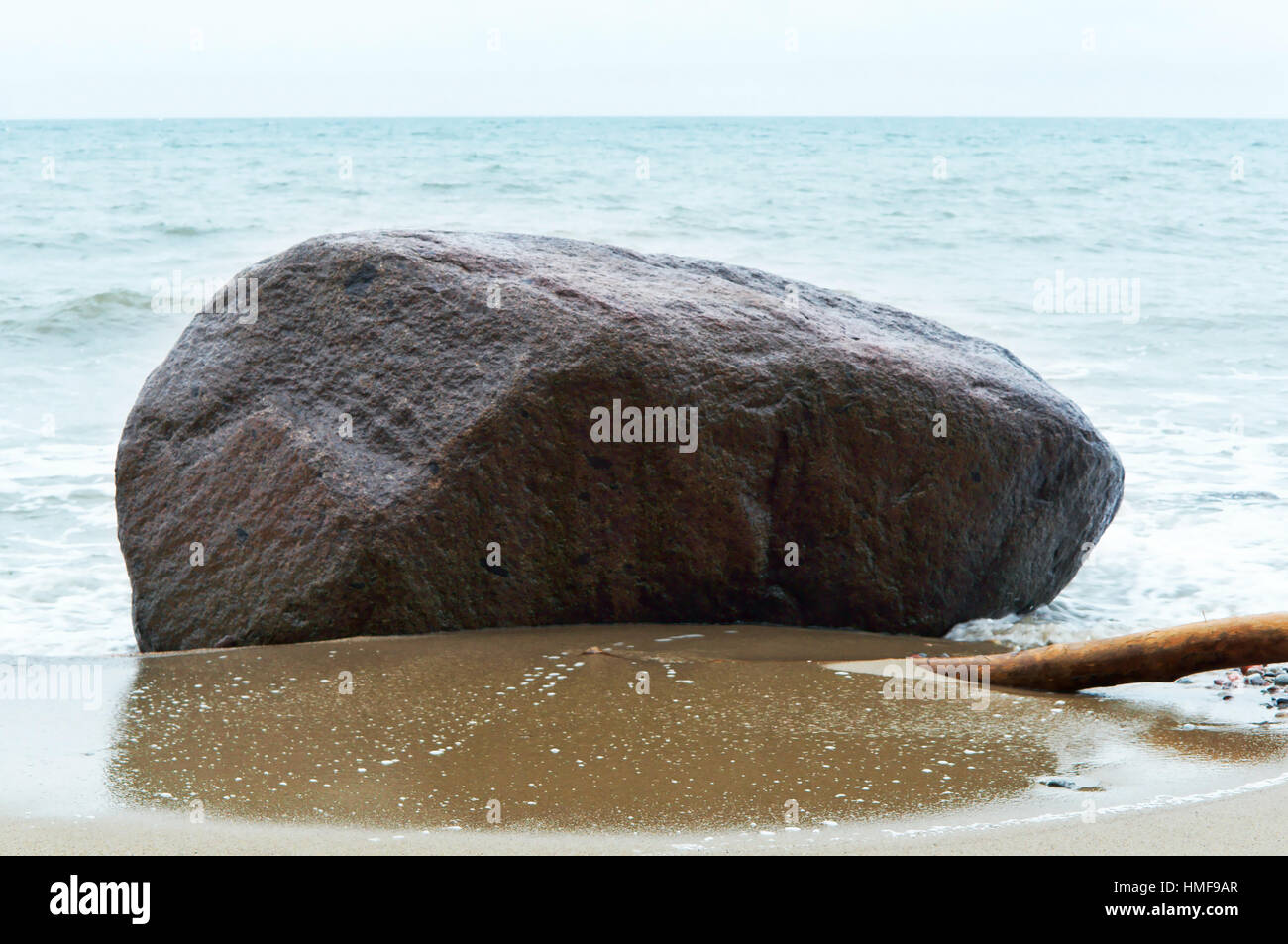 a huge stone boulder on the shore of the sea Stock Photo - Alamy