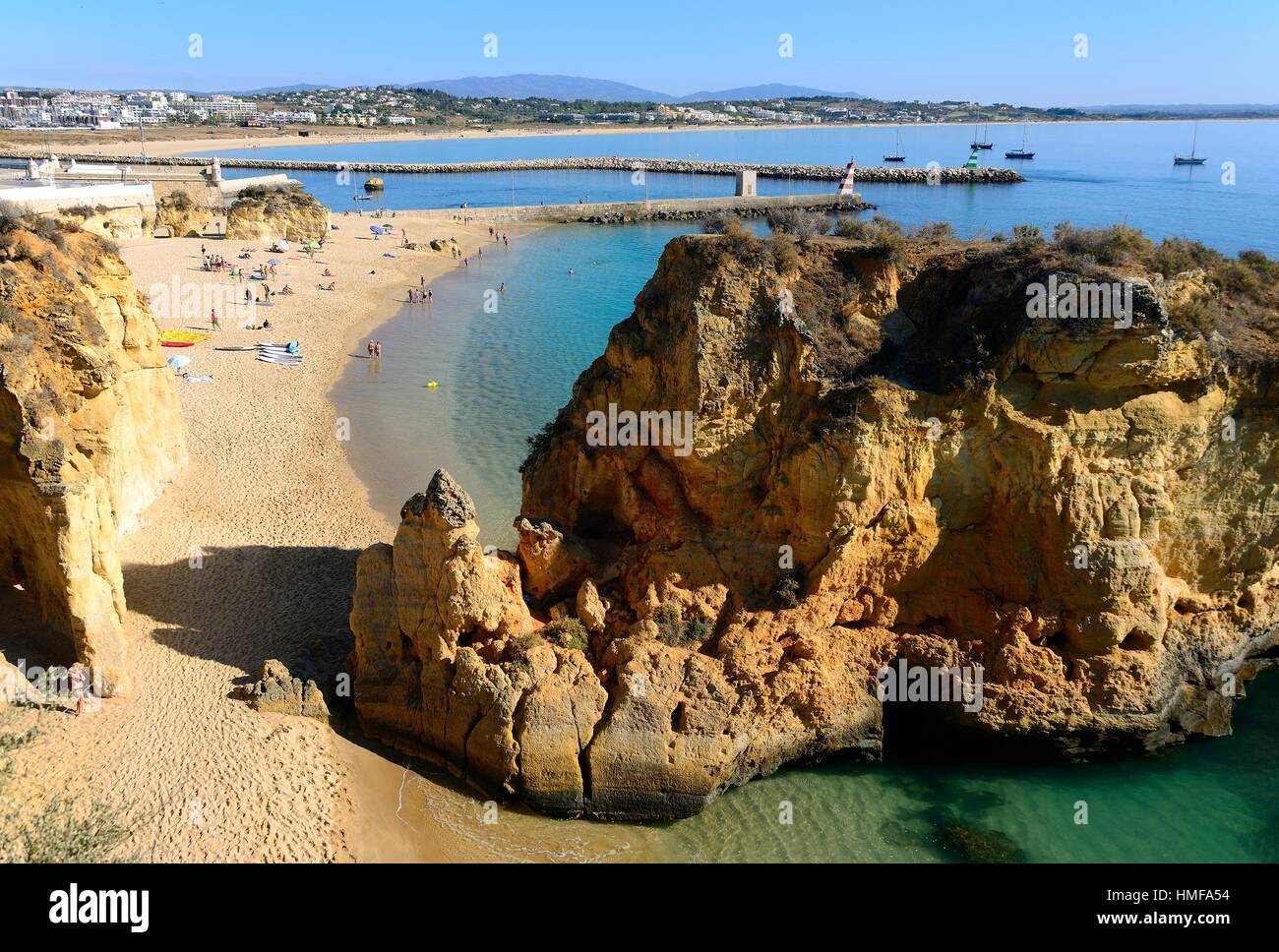Batata beach in city center of Lagos, in background Meia Praia, Lagos ...