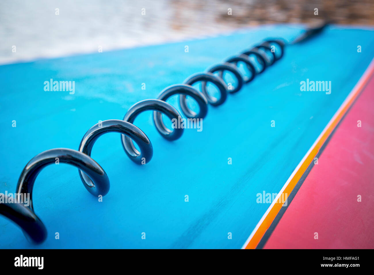 coil leash on a deck of stand up paddleboard - safety equipment Stock ...